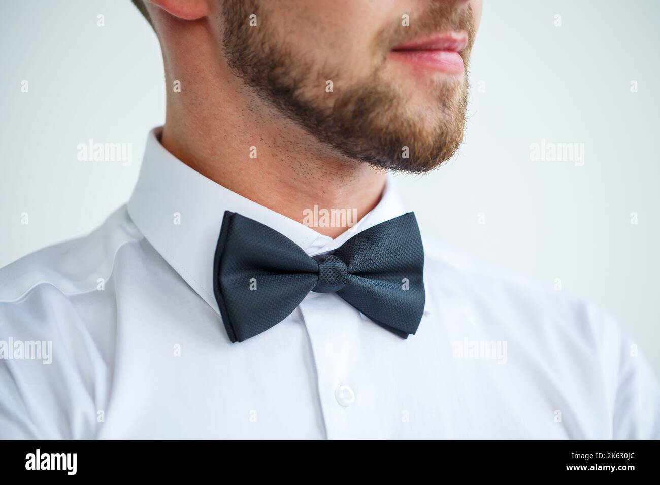 Young male businessman dressed in a white shirt with a short beard ...