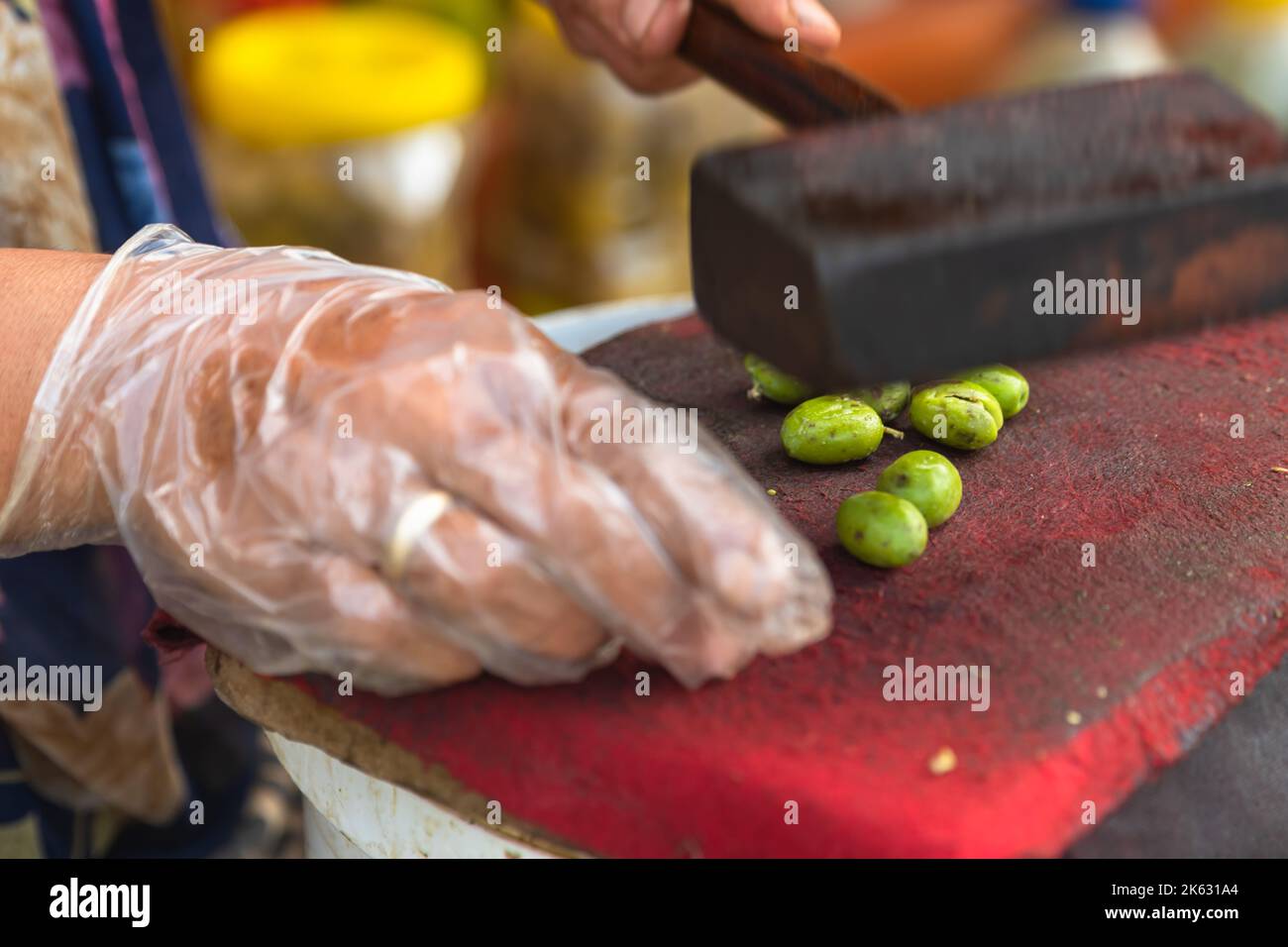 traditional handmade green olive crushing process , unhygienic product ...