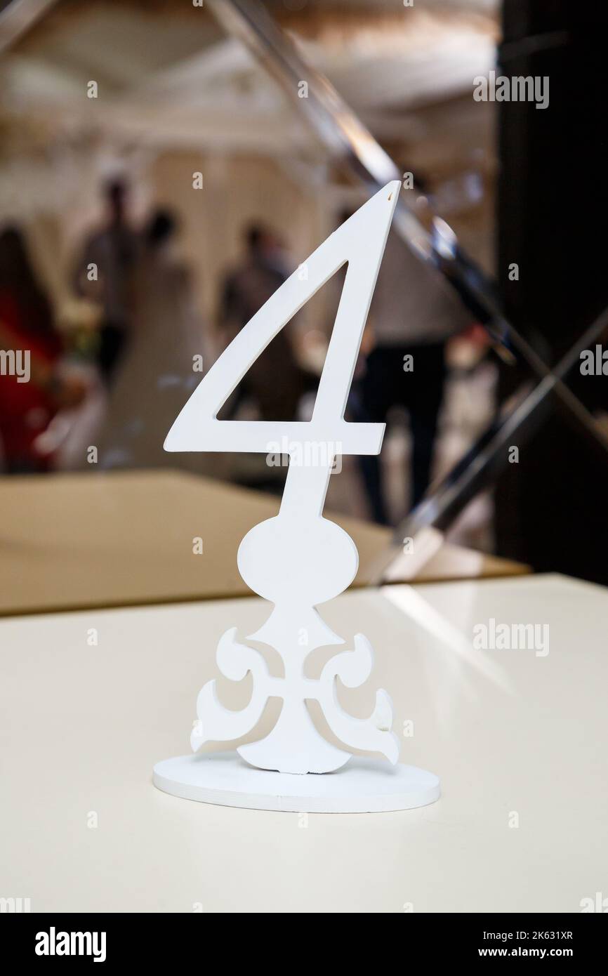 Numbers carved from wood on a stand Stock Photo - Alamy