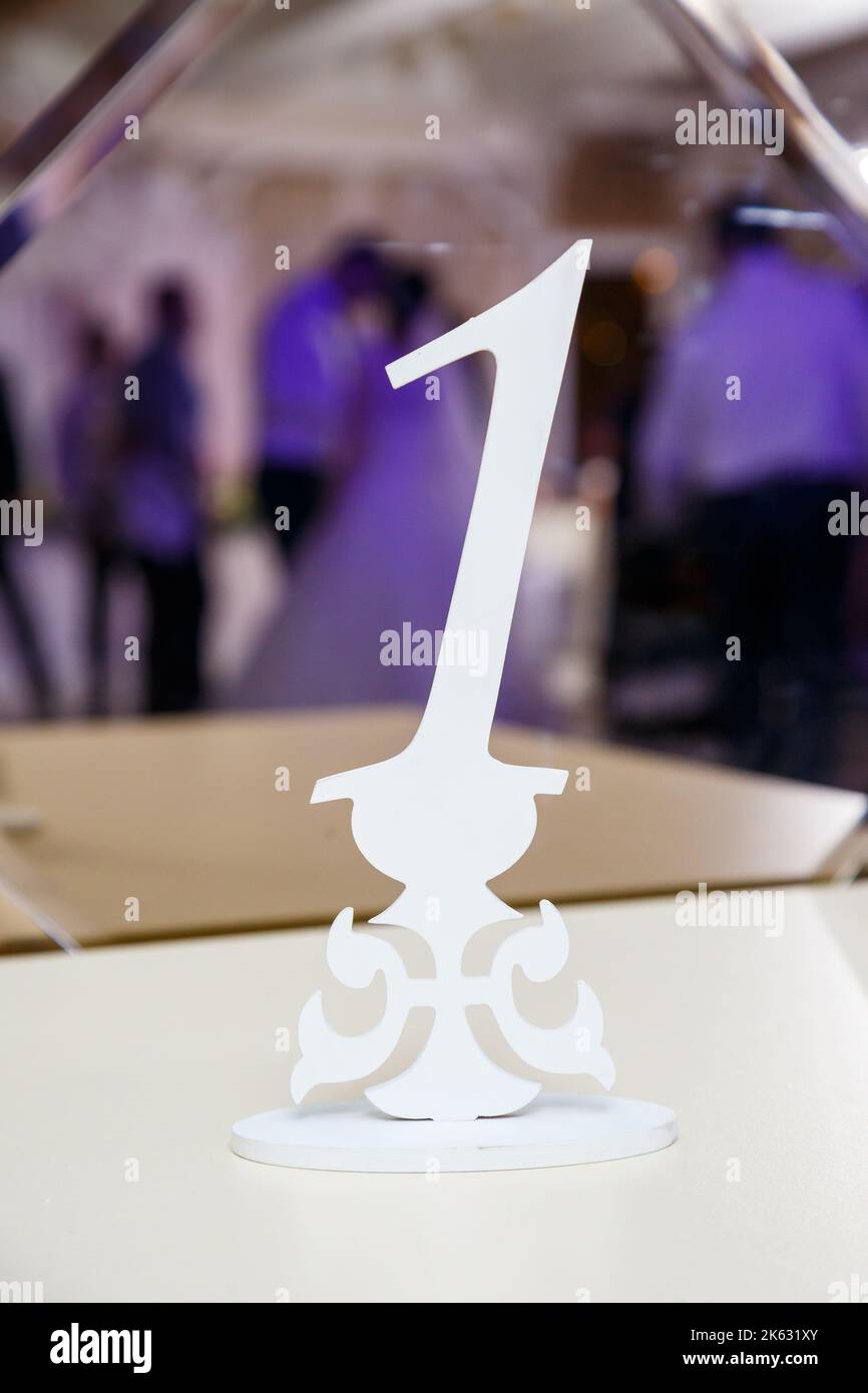 Numbers carved from wood on a stand Stock Photo - Alamy