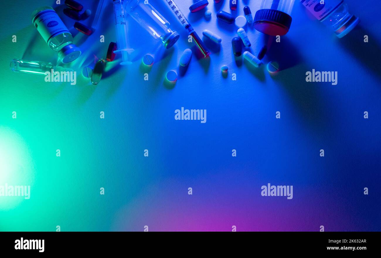 drug background covid-19 treatment syringe pills Stock Photo - Alamy