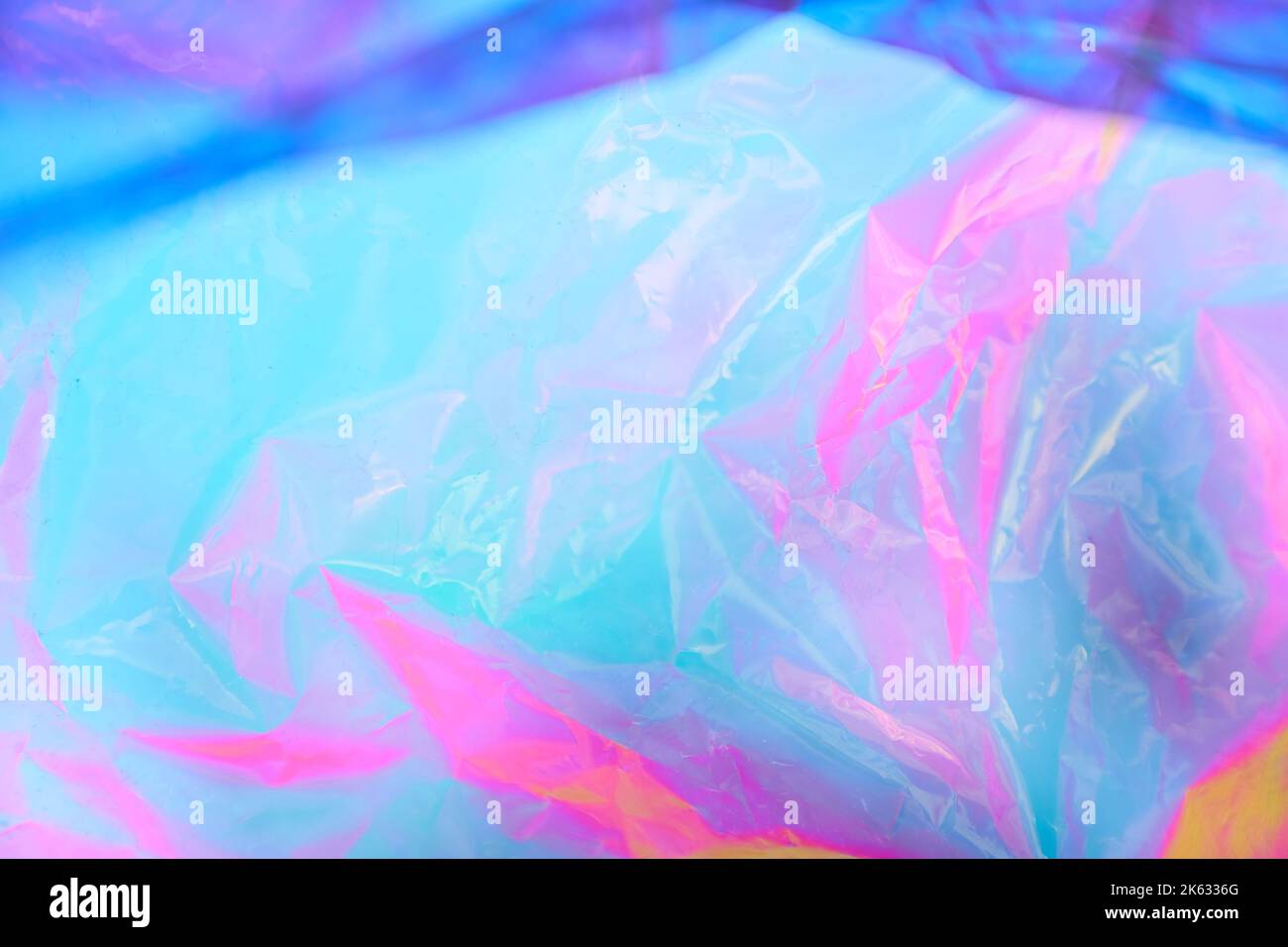 Holographic colorful plastic film in blue tones. Transparent ...