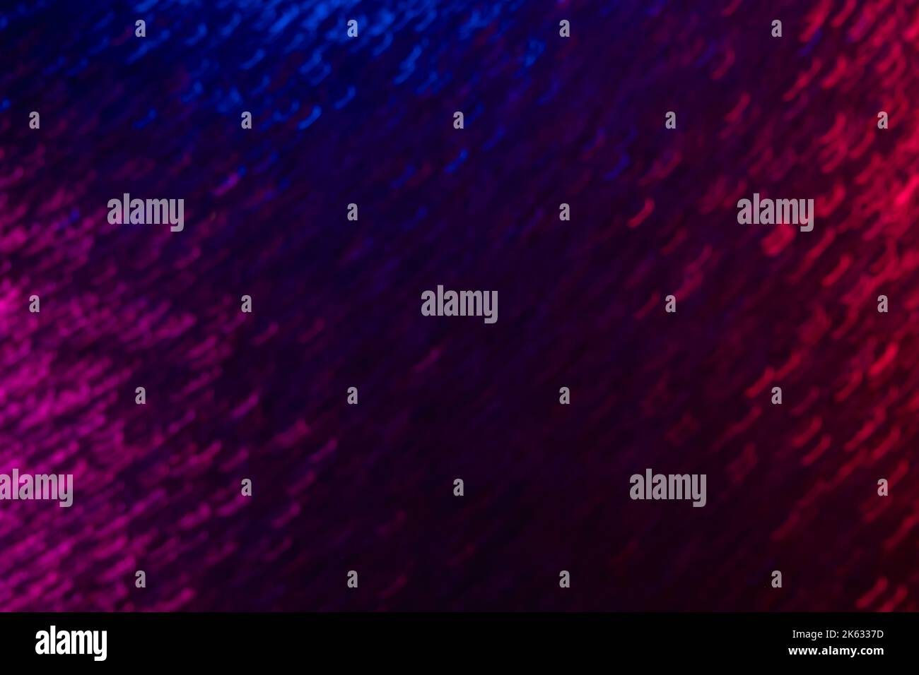 fluorescent background blur neon sparks purple red Stock Photo - Alamy