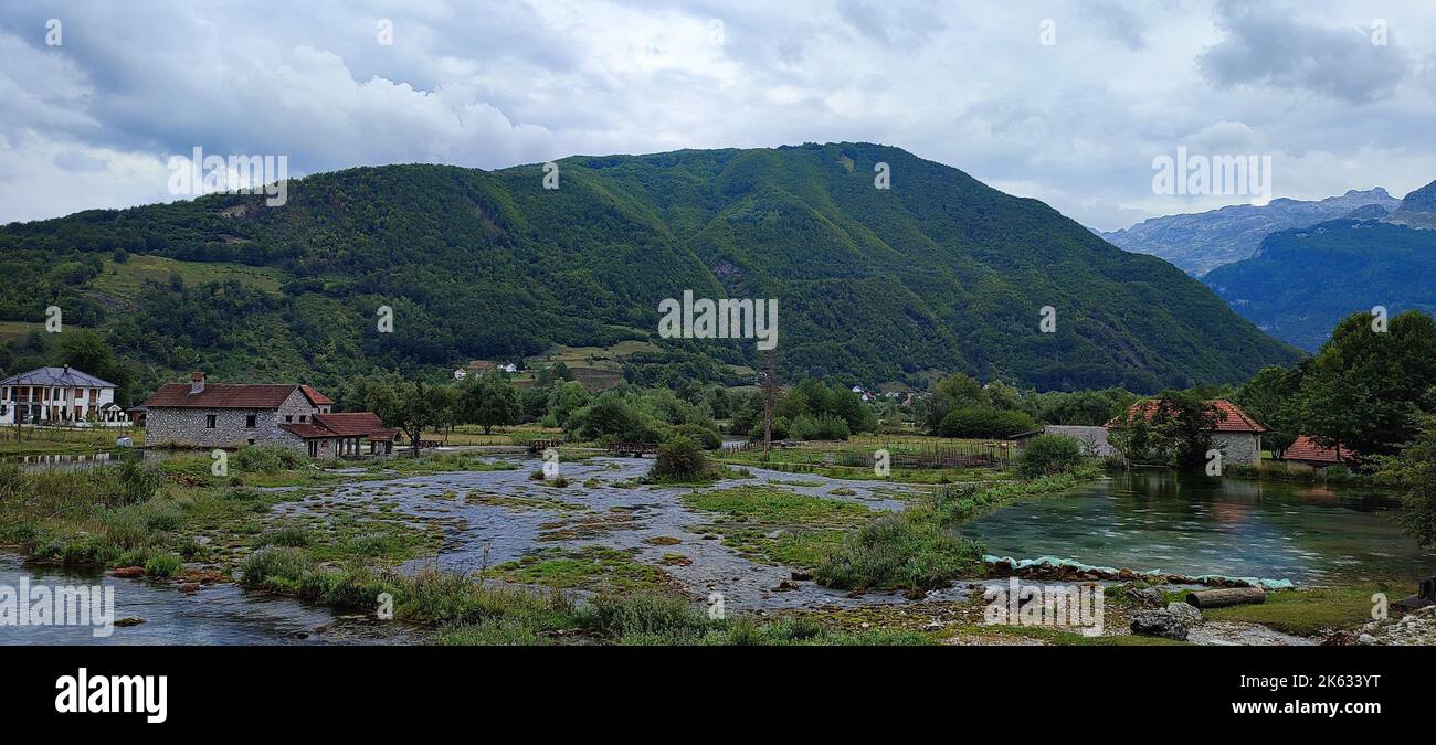 Beautiful landscape of a small village surrounded by mountains and ...
