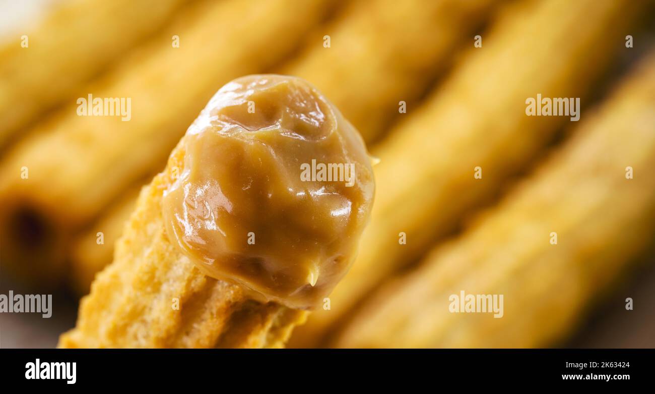 churros, fried sweet stuffed with dulce de leche, traditional from ...