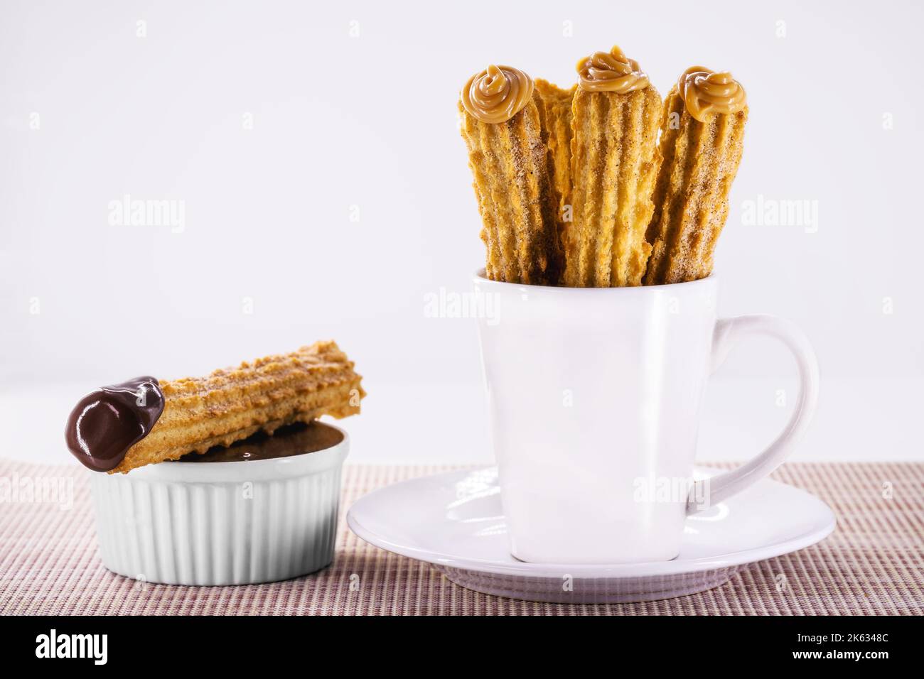 churros in a mug, traditional fried sweet from Latin America, Brazil ...