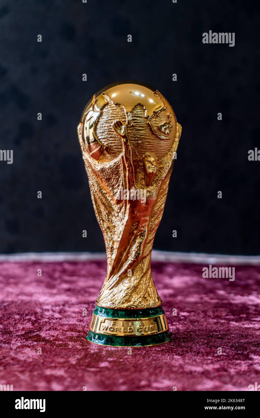 FIFA World Cup Trophy isolated against black background Stock Photo - Alamy