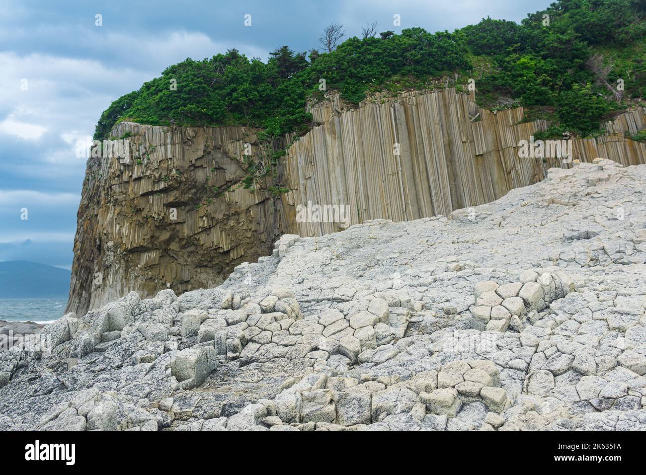 Columnar basalt rock, Cape Stolbchaty on Kunashir Island, in the ...
