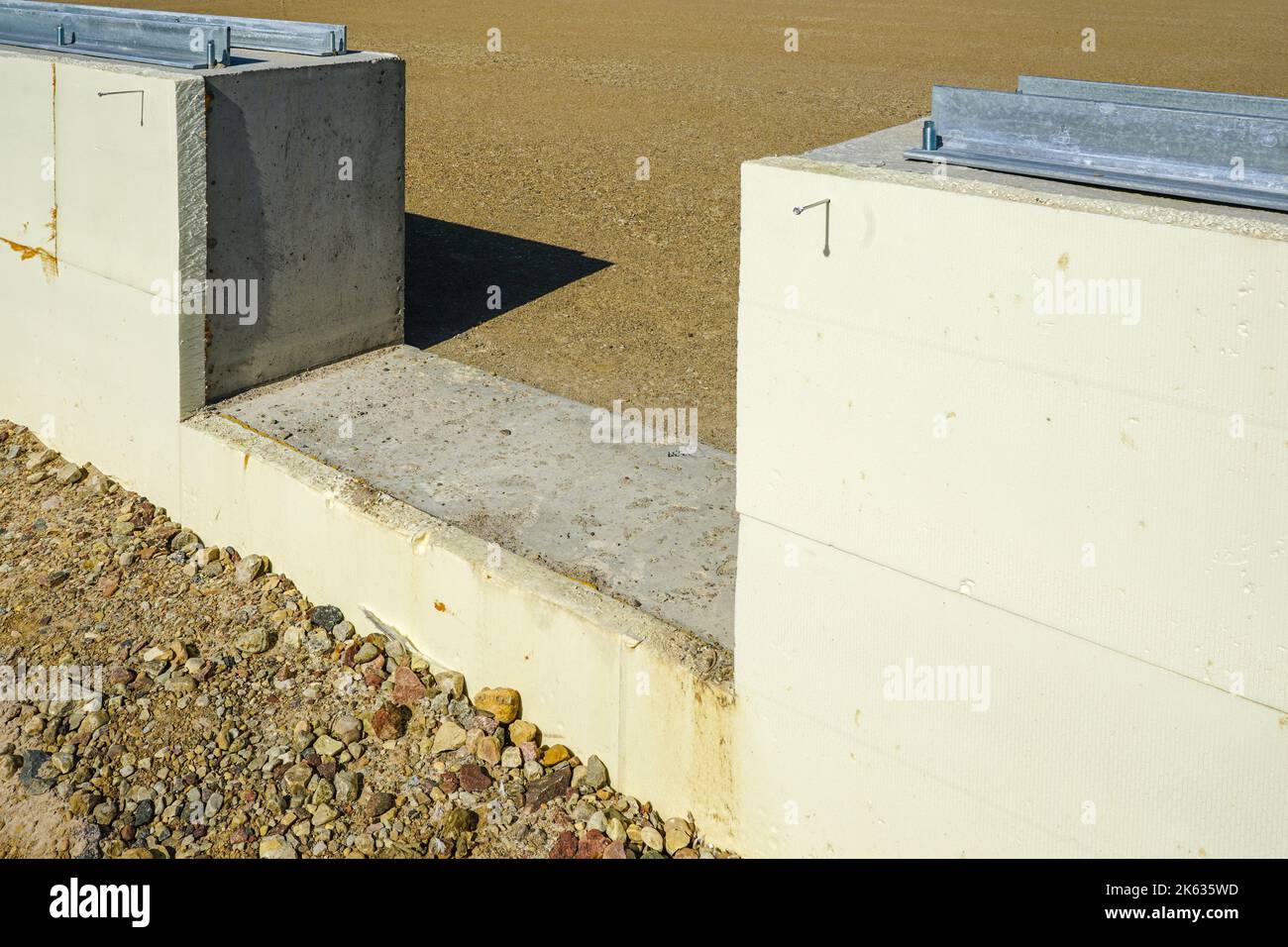 prepared base and concrete border for installation of inflatable ...