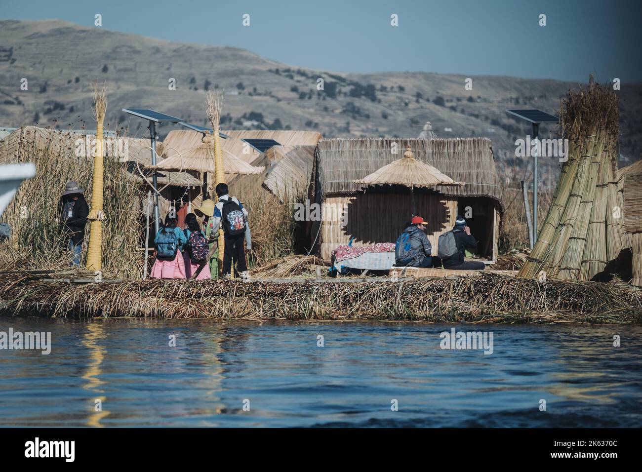 A straw house and people on the shore Stock Photo - Alamy