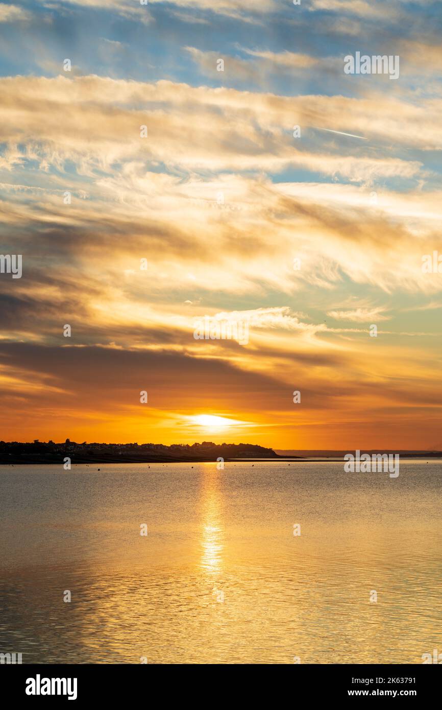 Sunset with a lot of cloud in the sky, over the Kent coastal town of ...