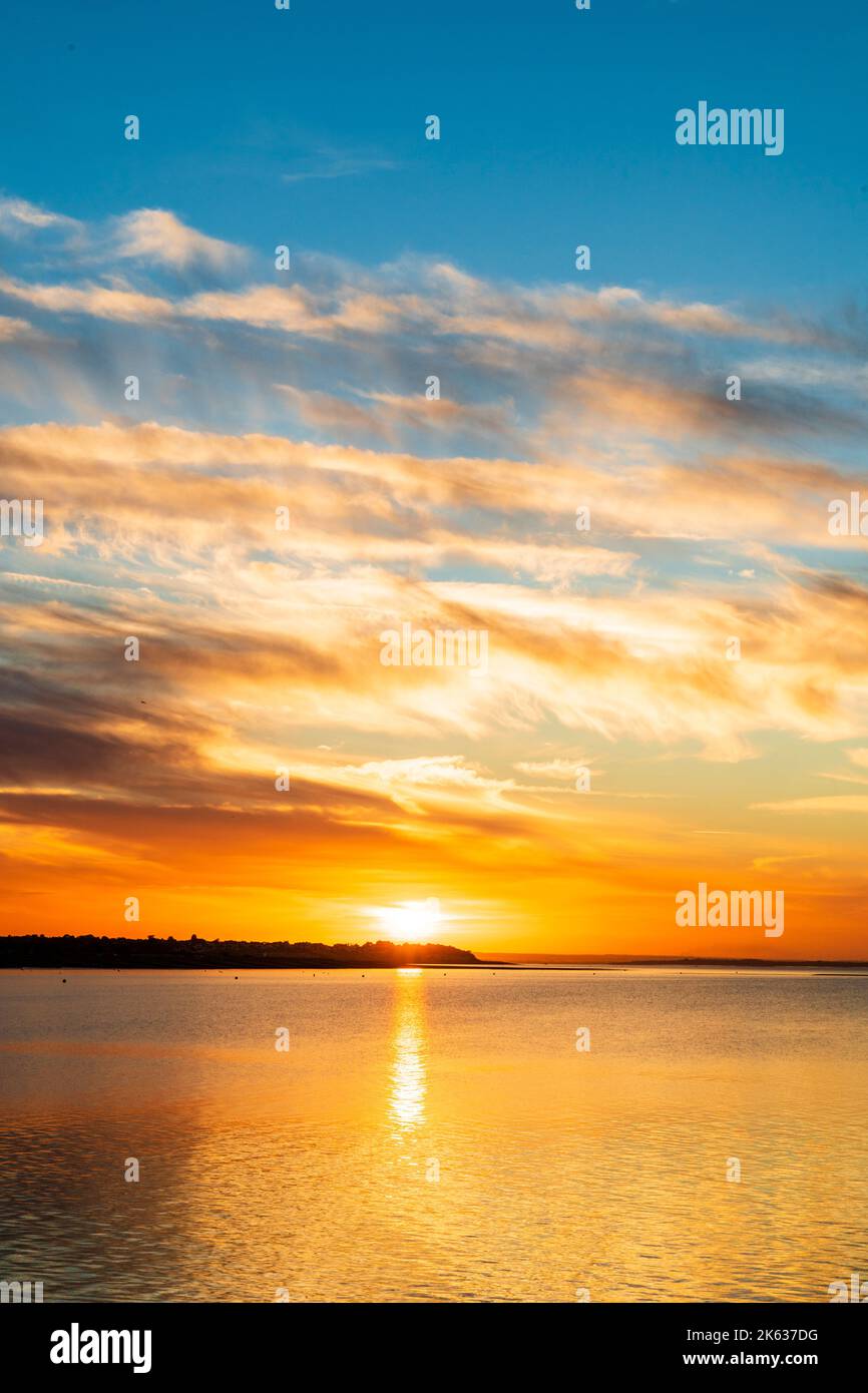 Sunset with a lot of cloud in the sky, over the Kent coastal town of ...