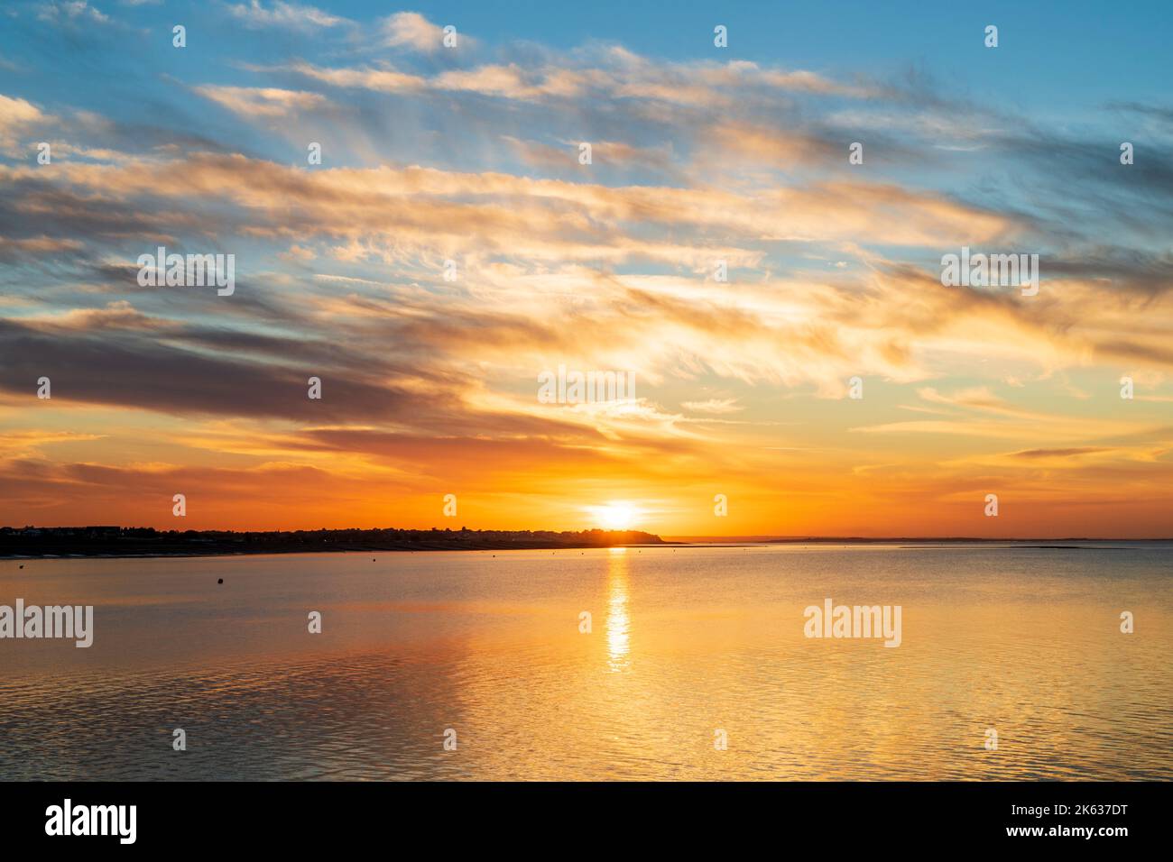 Sunset with a lot of cloud in the sky, over the Kent coastal town of ...