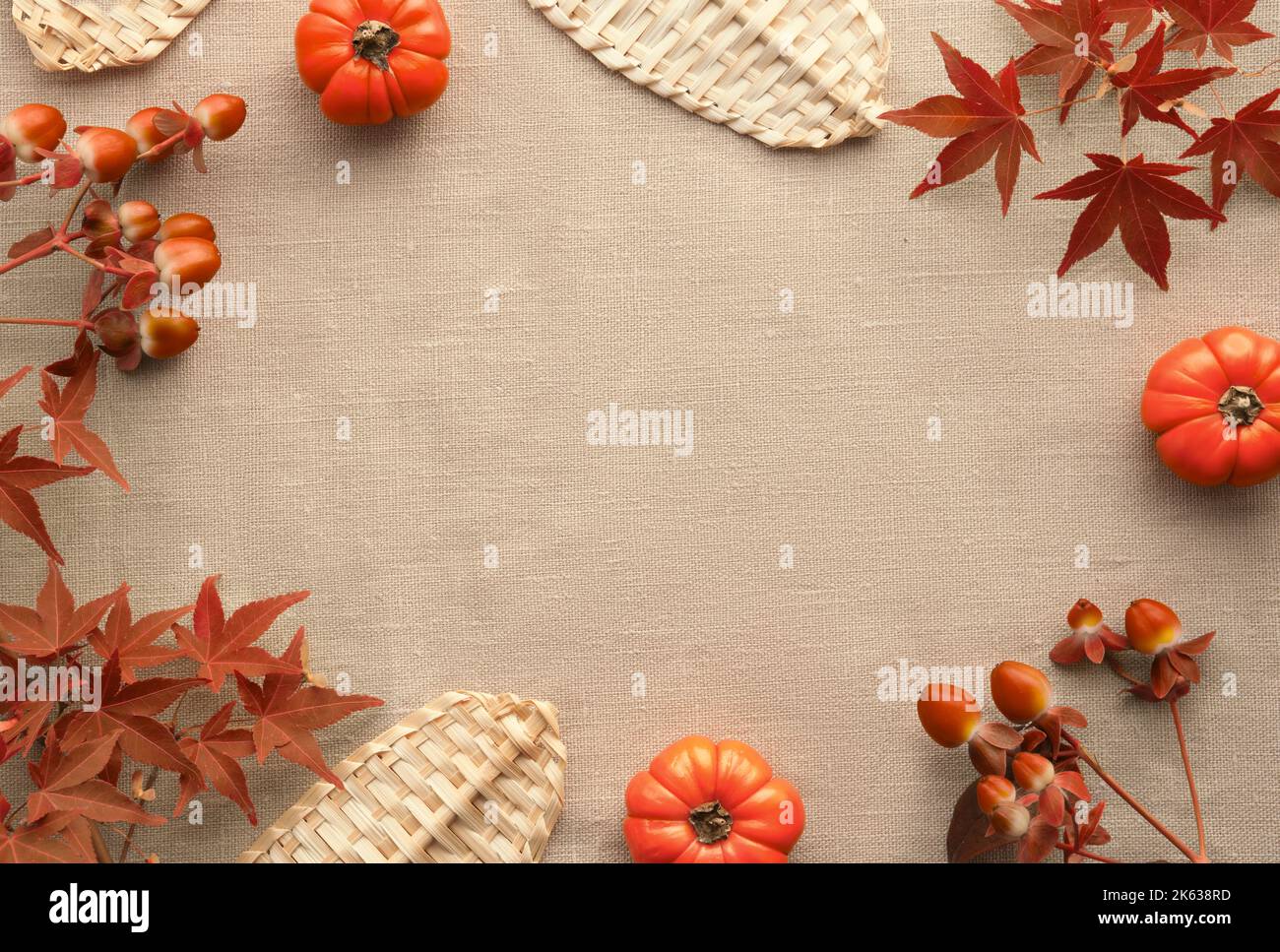Autumn flat lay, frame made with deco orange pumpkins, straw leaves and ...