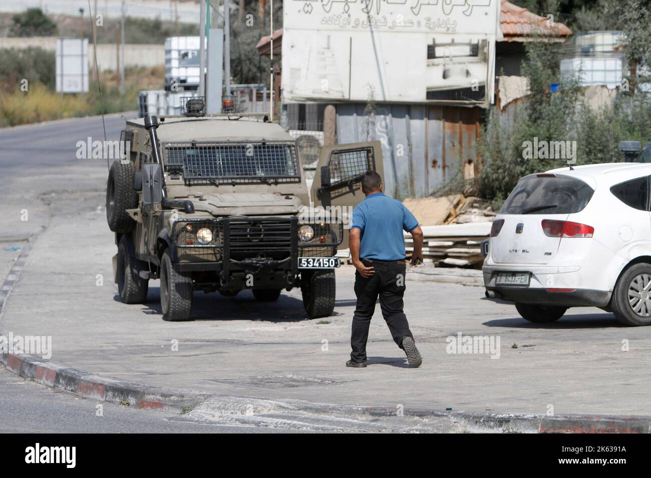 Israeli soldiers take part during a search for a gunman who shot and wounded an Israeli settler ...