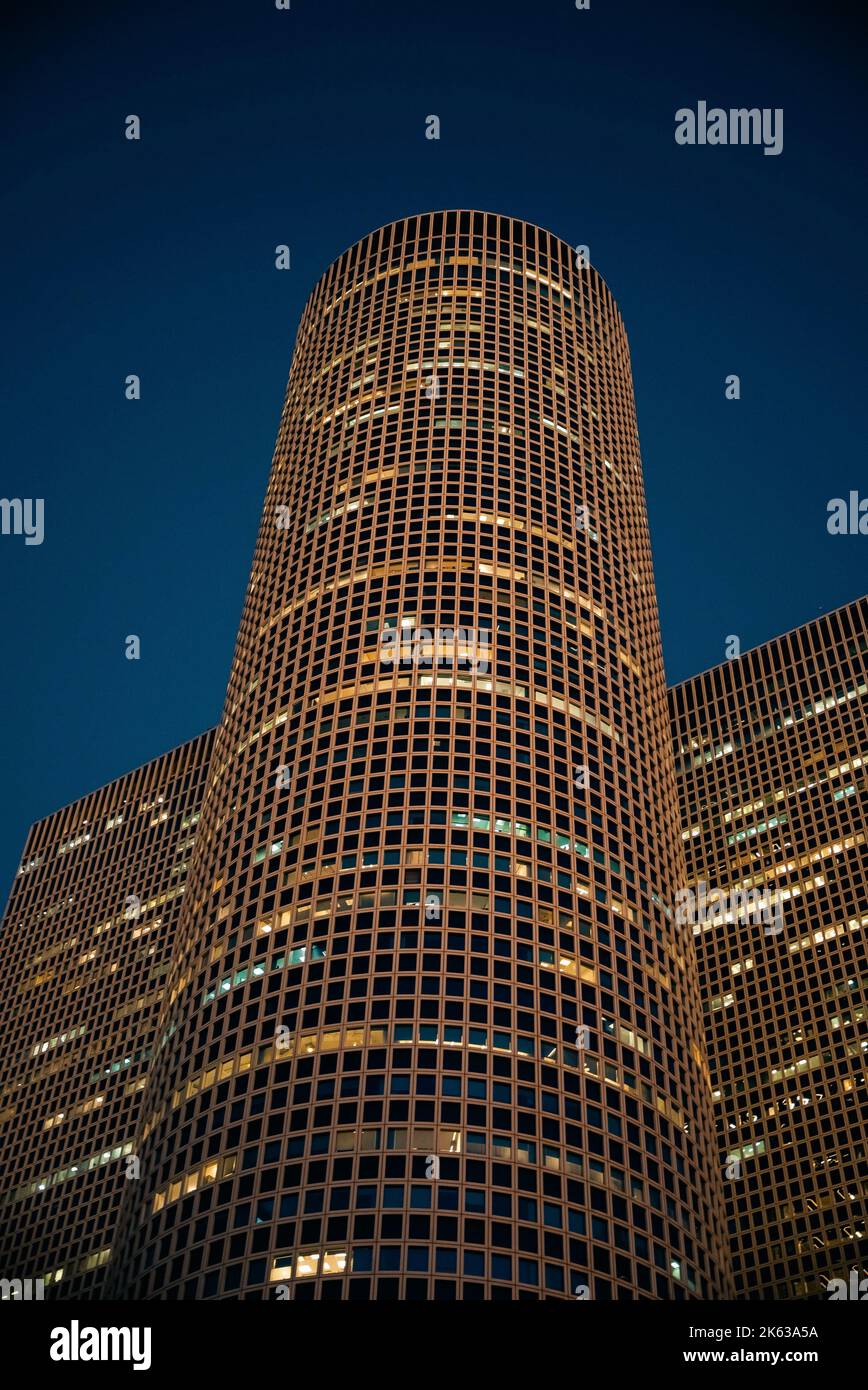 A vertical of the Azrieli Center skyscraper at night in Tel Aviv ...