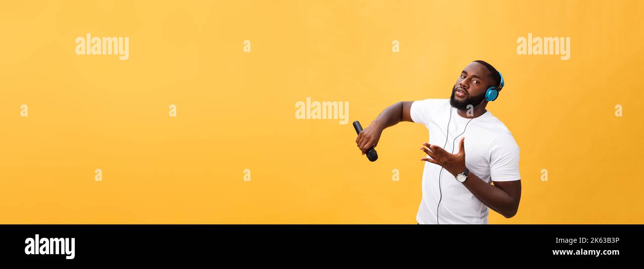 Portrait of cheerful positive chic handsome african man holding ...