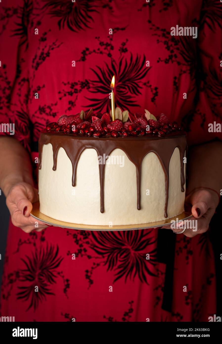 Food photography of birthday cake, raspberry, pomegranate, chocolate ...