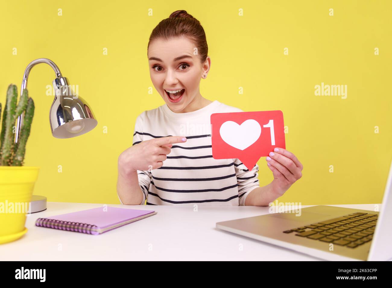 Excited happy young adult woman making point of view photo while ...