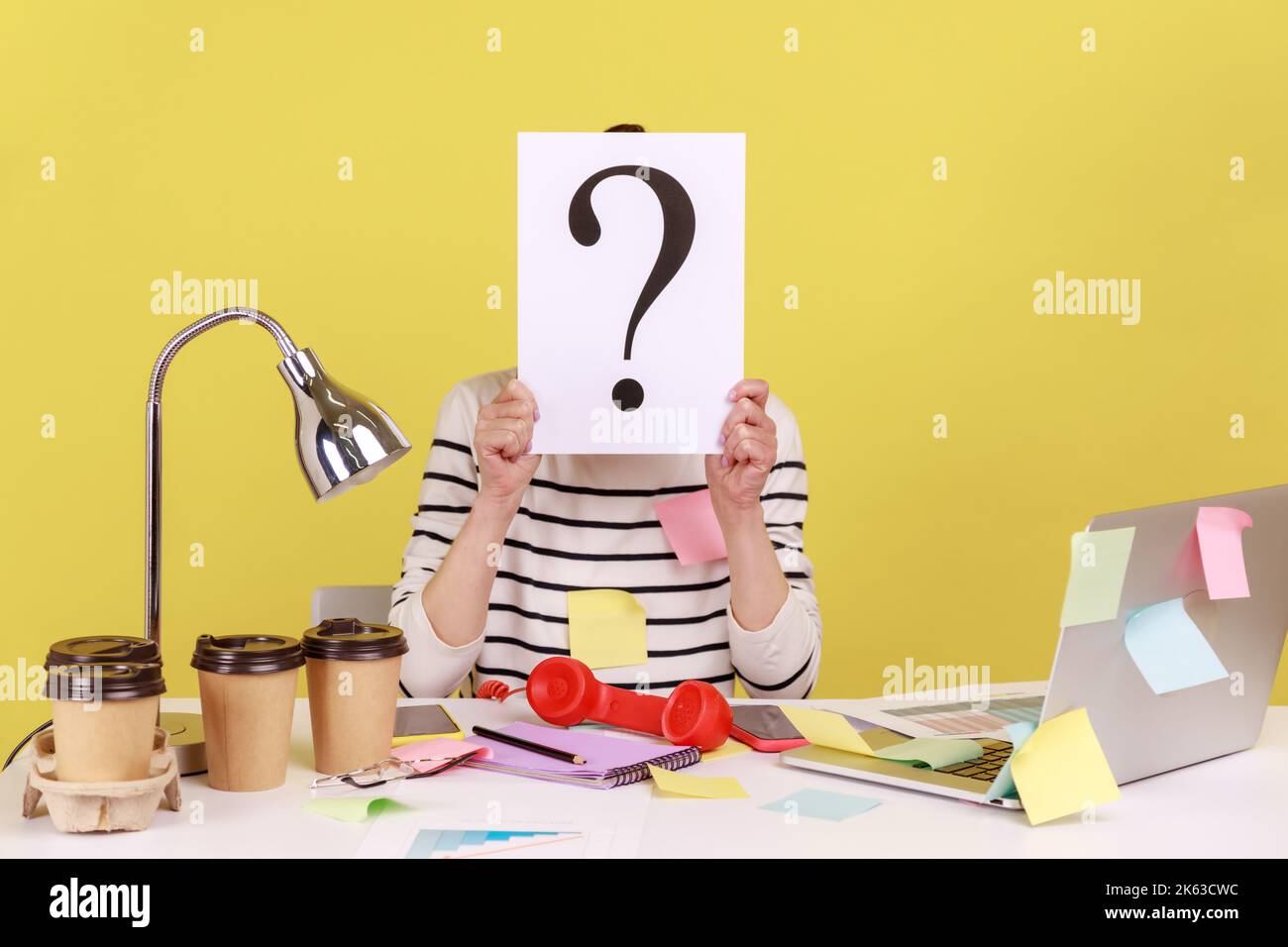 Anonymous woman covered with sticky notes hiding her face behind white ...