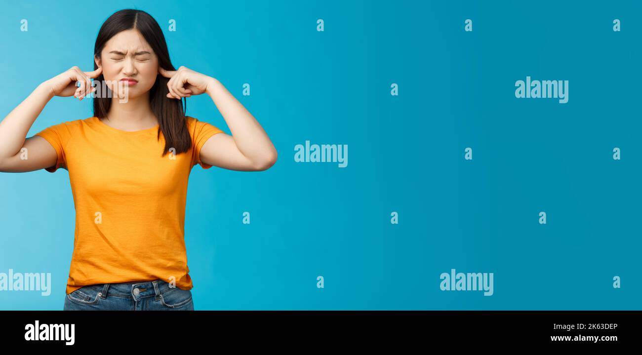 Upset gloomy intense and stressed female student cannot stand loud ...