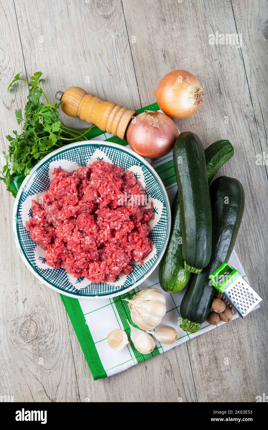 Fresh ingredients to cook stuffed zucchini with beef meat on the ...