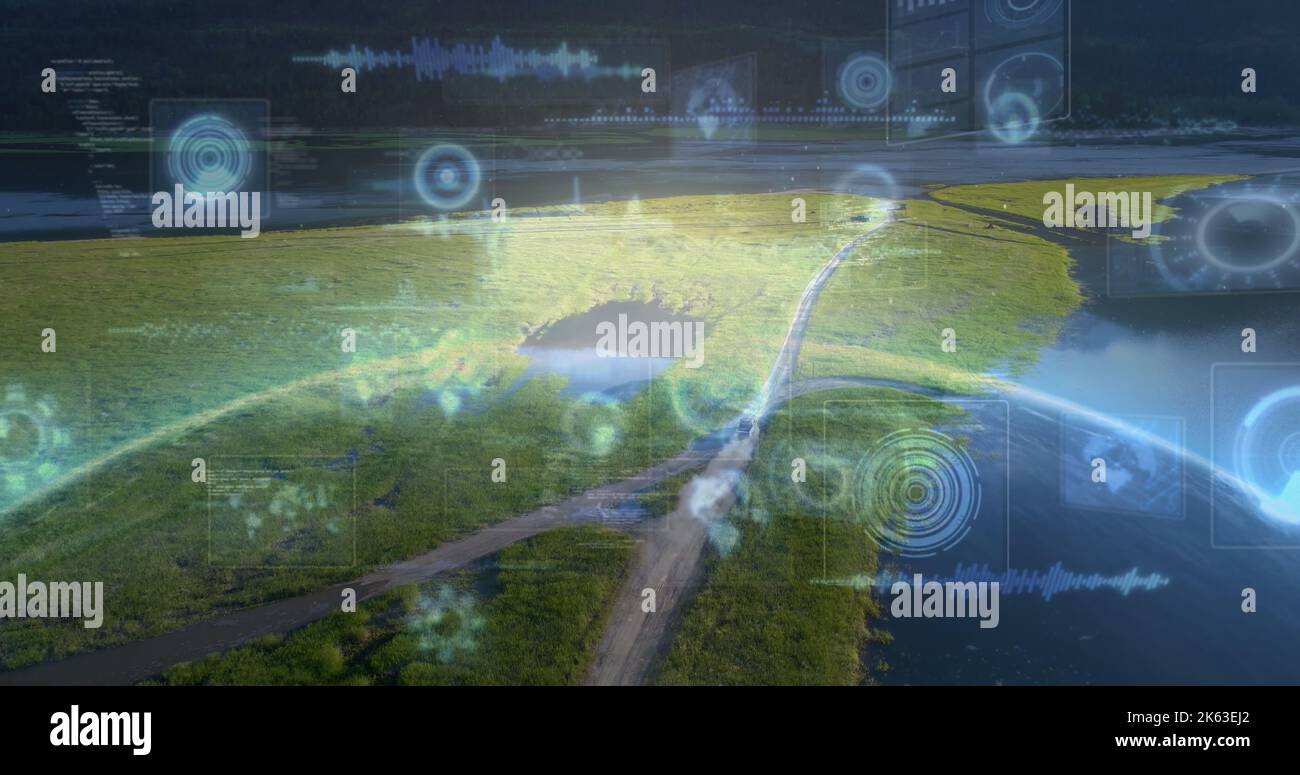 Composition of data processing with scope scanning and globe over landscape Stock Photo - Alamy