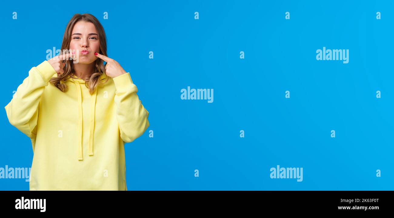 Women, lifestyle and emotions concept. Portrait of silly carefree girl ...