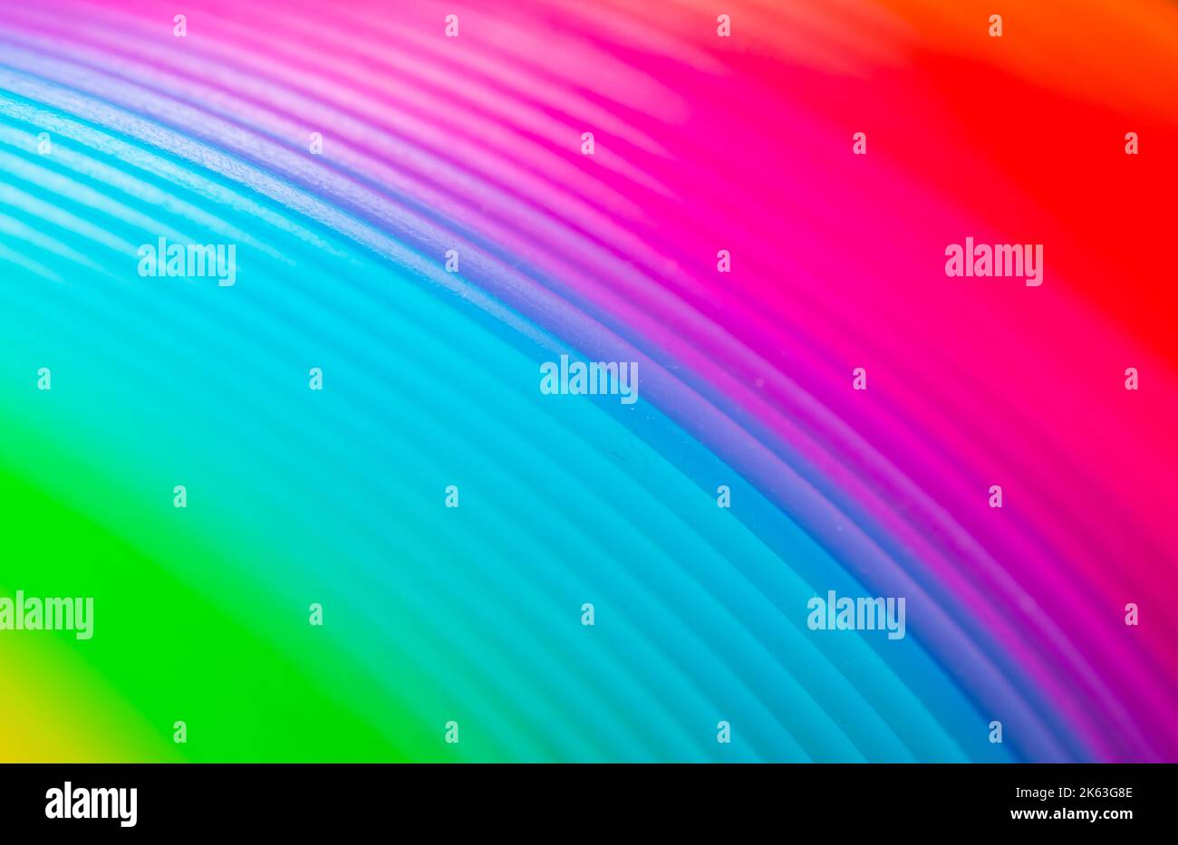 Details of a rainbow coloured plastic toy Stock Photo - Alamy