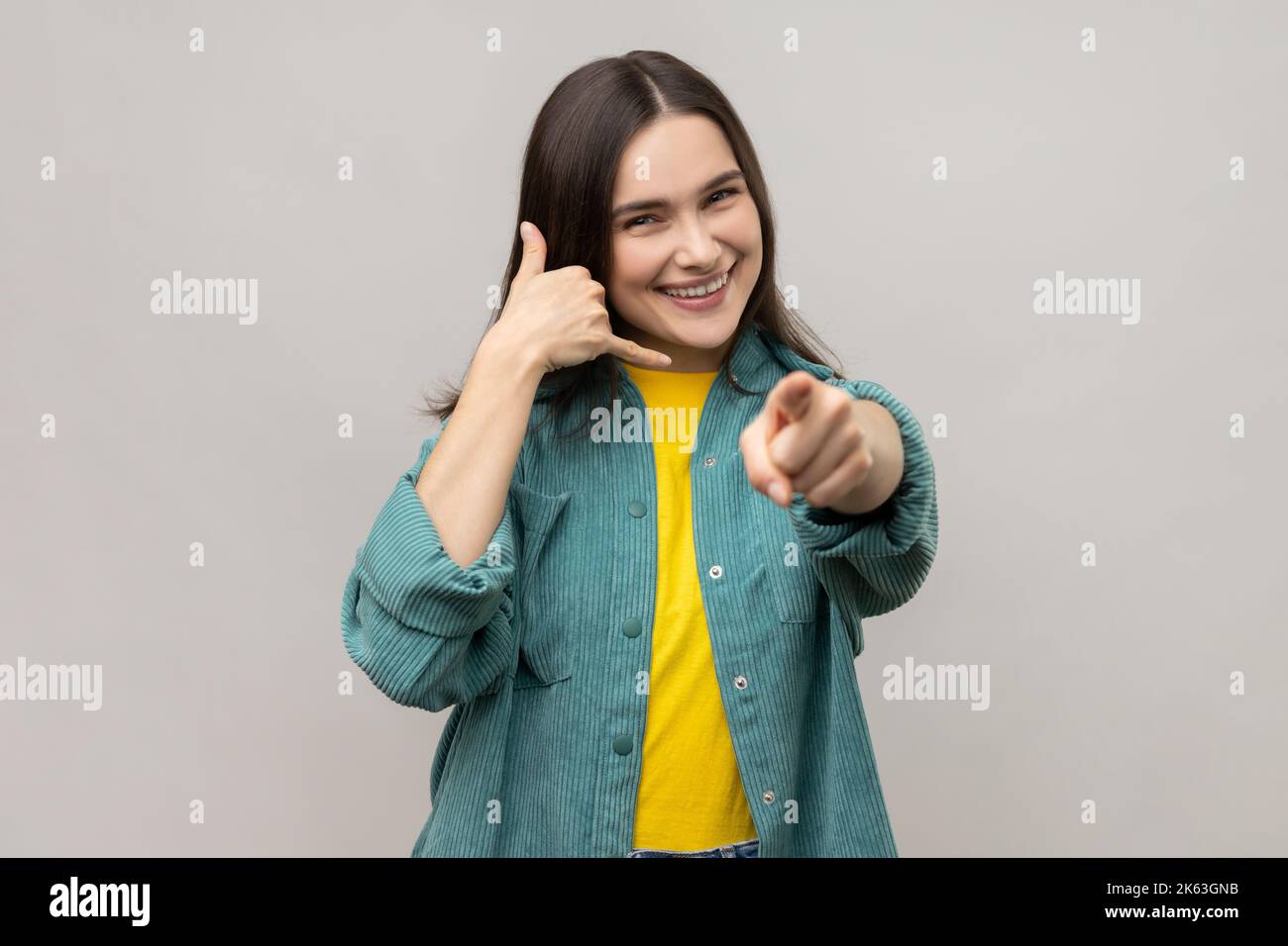 Hey you, call me back, let's contact by phone. Portrait of playful ...