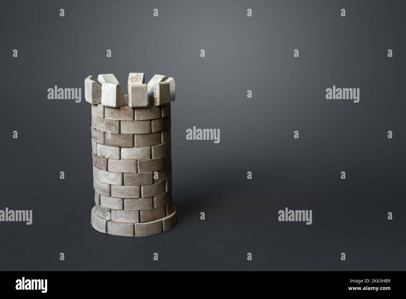 Medieval defense tower on a gray background. Safety, life and property ...