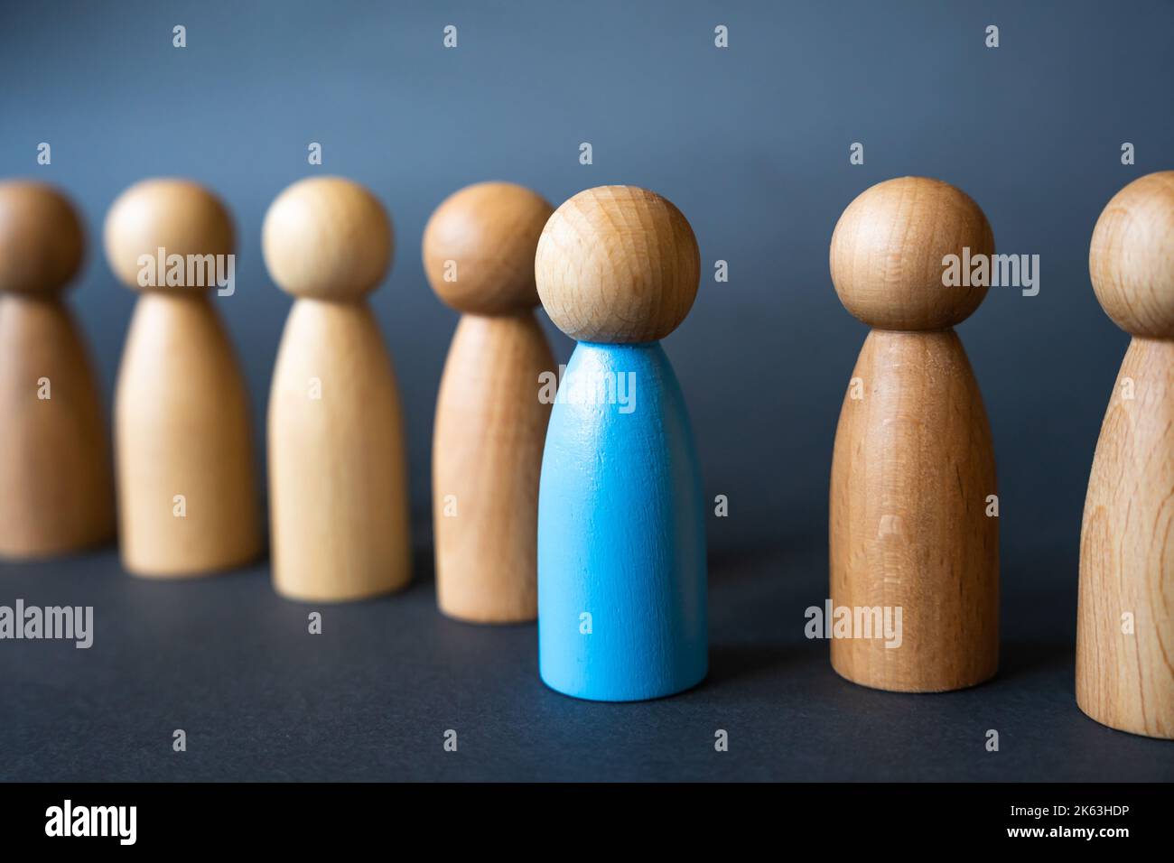 Blue man steps out of row line. Selected employee. Get a promotion ...