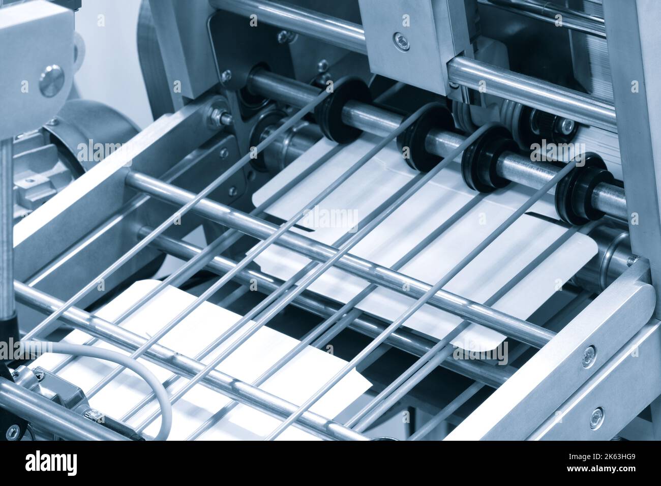 Elements of corton boxes are collected in stack. Conveyor line for the ...