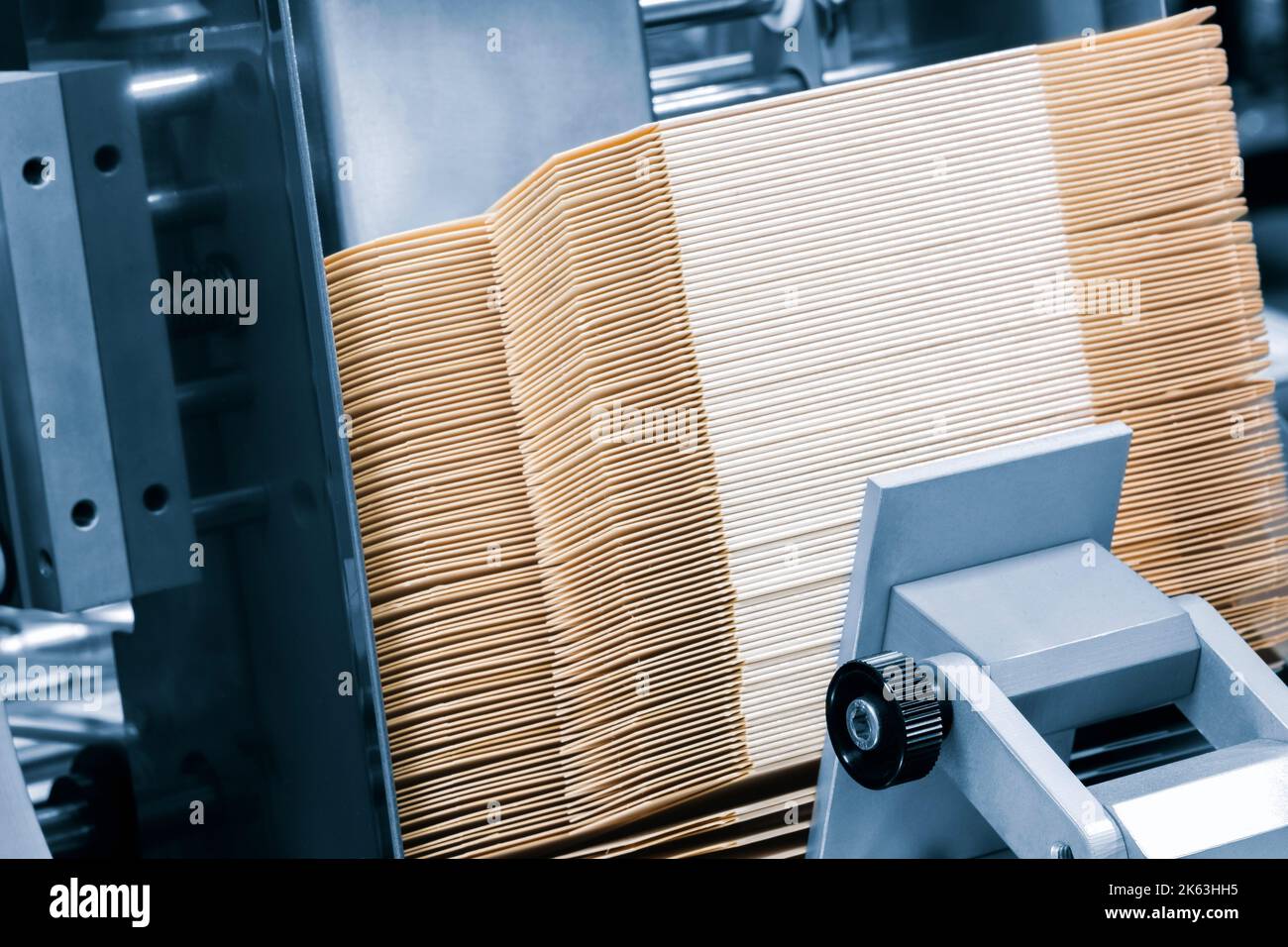 Elements of corton boxes are collected in stack. Conveyor line for the ...