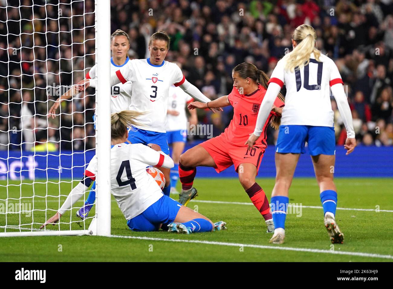 England's Fran Kirby (centre) attempts to get to the ball from pressure ...