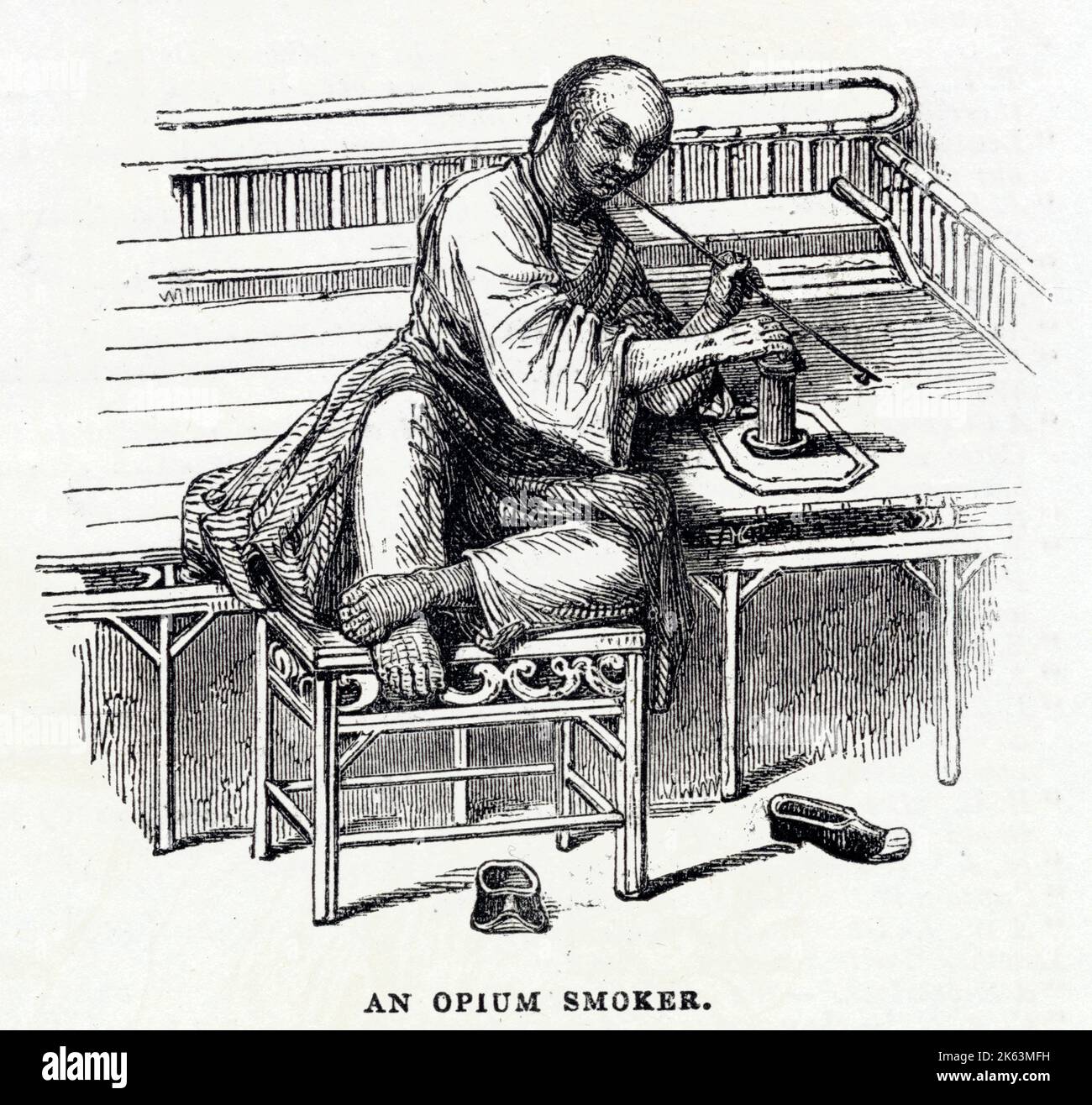 A Chinese man smoking opium Stock Photo - Alamy