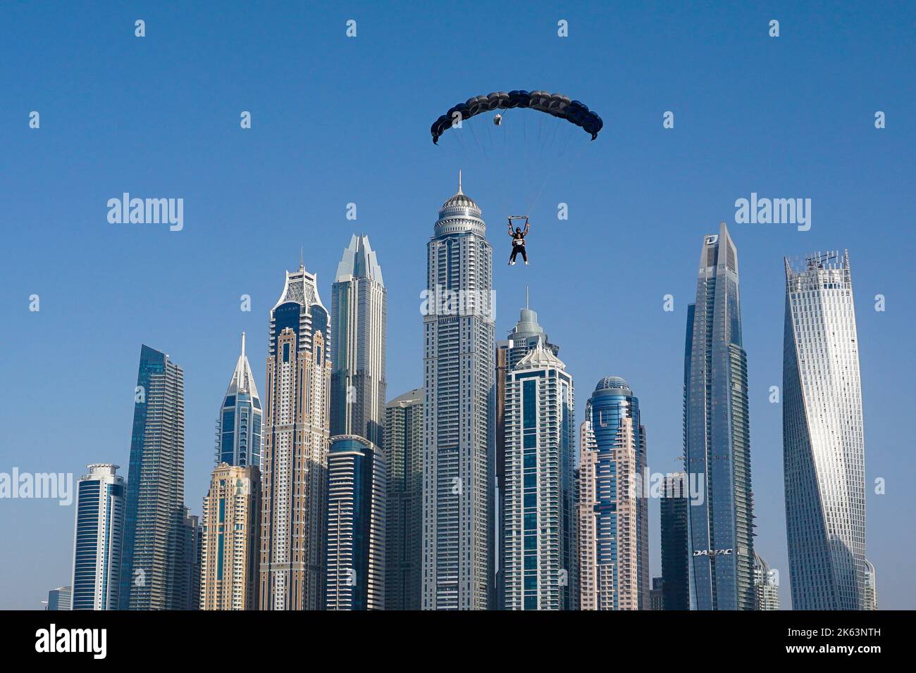 Dubai, United Arab Emirates - Tandem skydivers descend safely back to ...