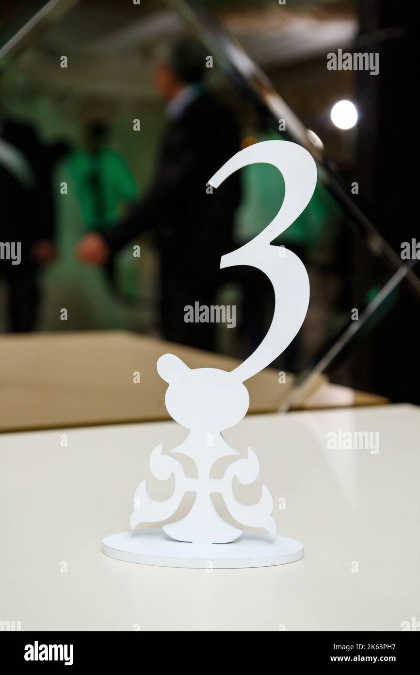 Numbers carved from wood on a stand Stock Photo - Alamy