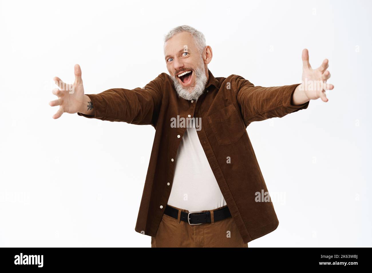 Smiling happy old man, grandfather stretching out hands, reaching for ...