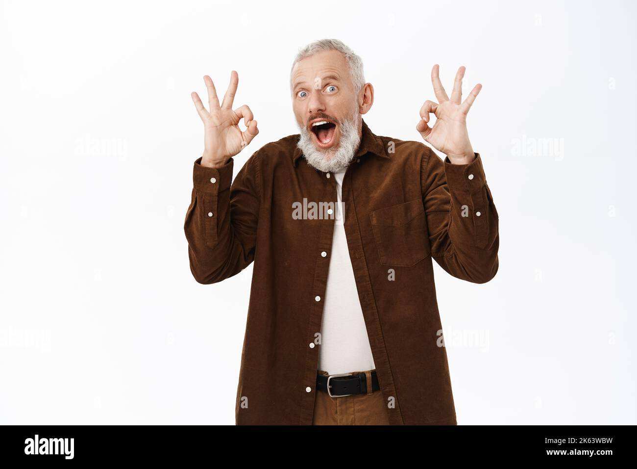 Super good. Impressed funny old guy, senior man showing okay sign ...