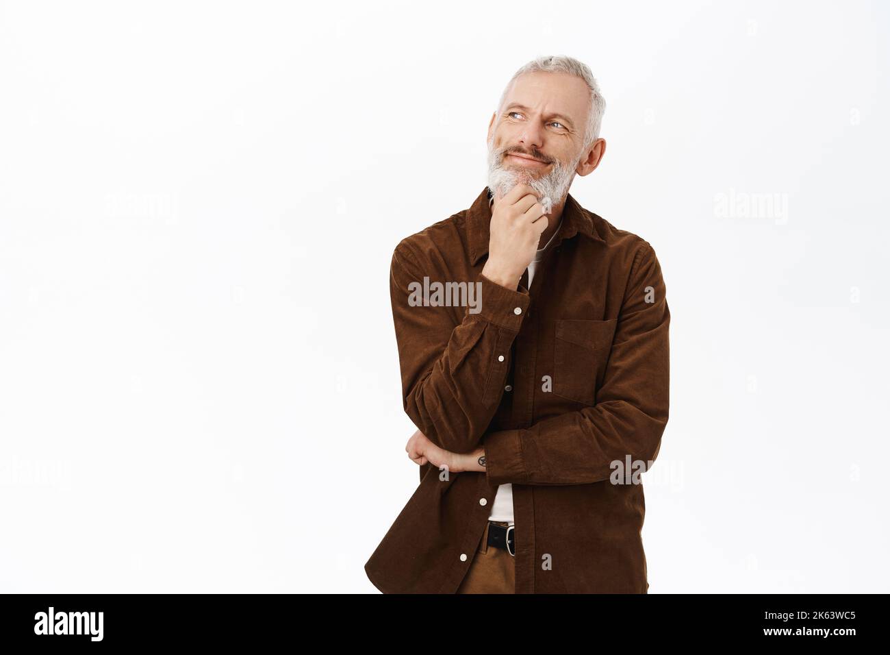 Thoughtful senior man, looking aside and planning, thinking of ...