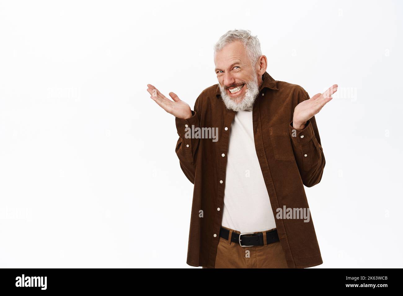 Handsome senior man, mature guy 50 years old shrugging shoulders and ...