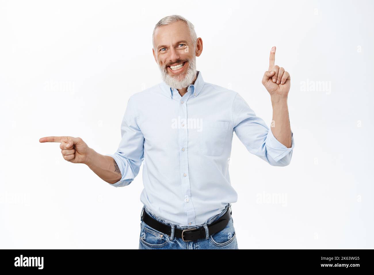 Portrait of senior business man pointing up and left, showing two ...
