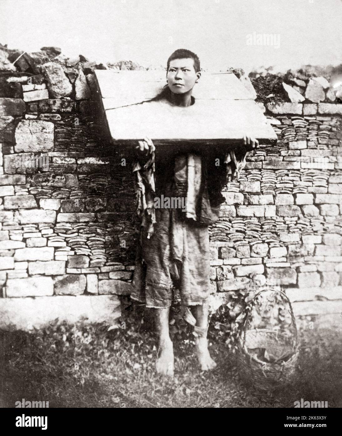Man in a Cangue (punishment) China, circa 1880s Stock Photo - Alamy