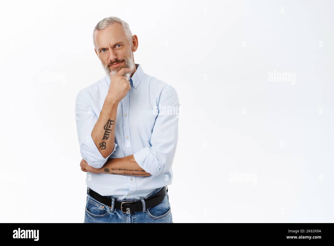 Thoughtful businessman looking down and thinking, pondering with ...