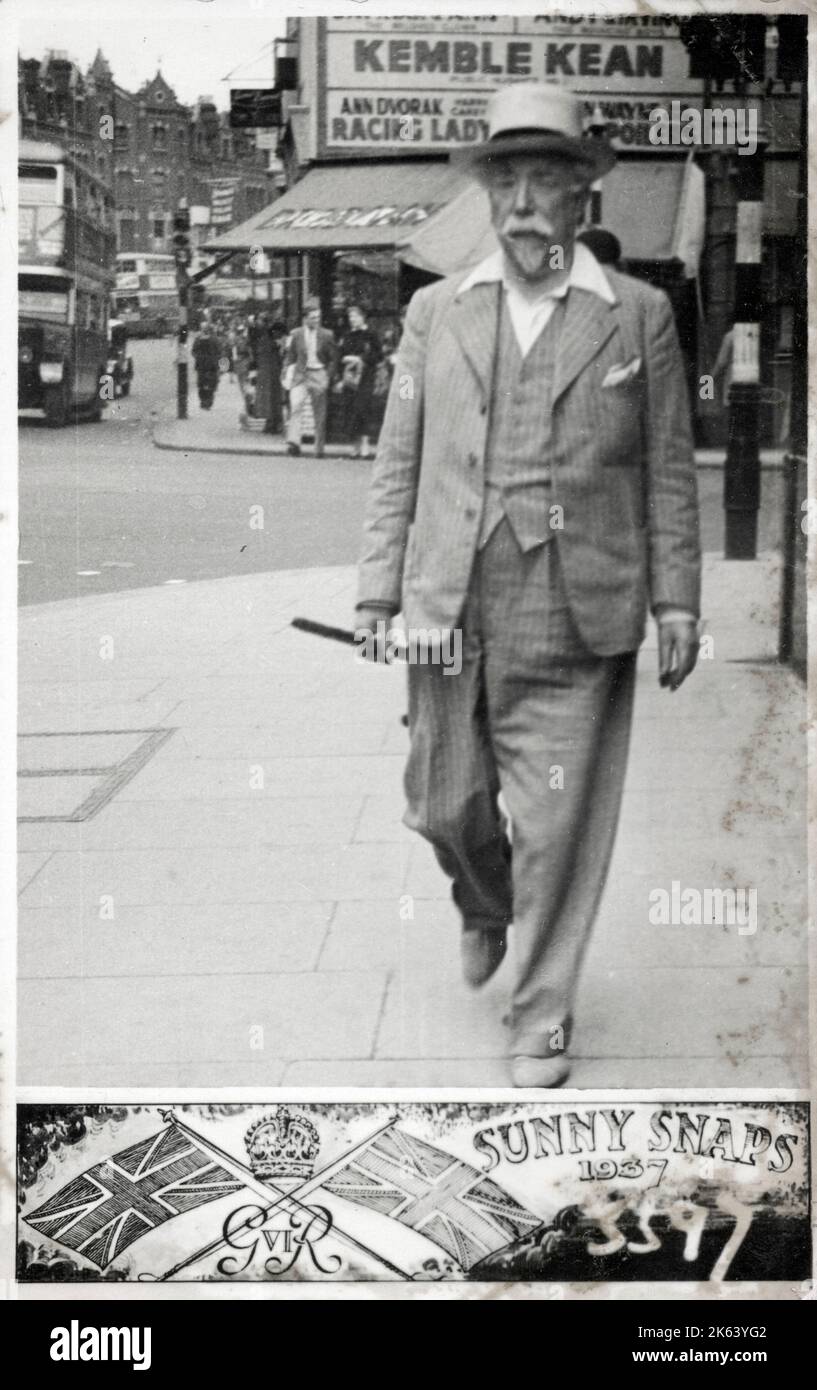 Smartly-dressed older man in a pinstripe three-piece suit and wearing a ...