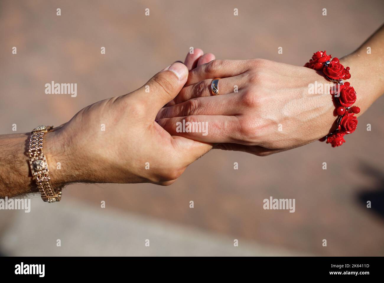 Bride and groom hold hands on wedding day Stock Photo - Alamy