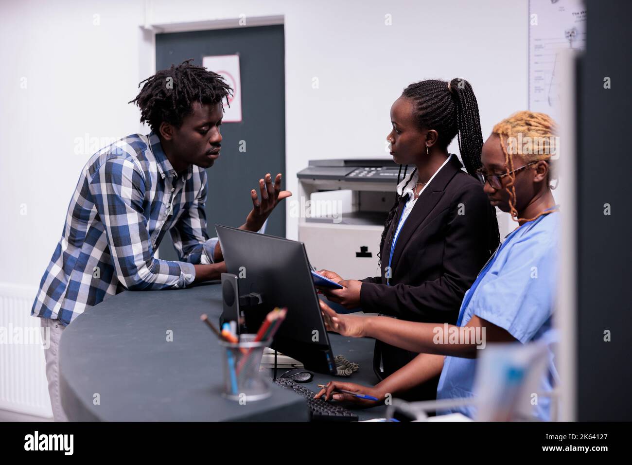 Medical team helping patient with appointment, having checkup visit ...