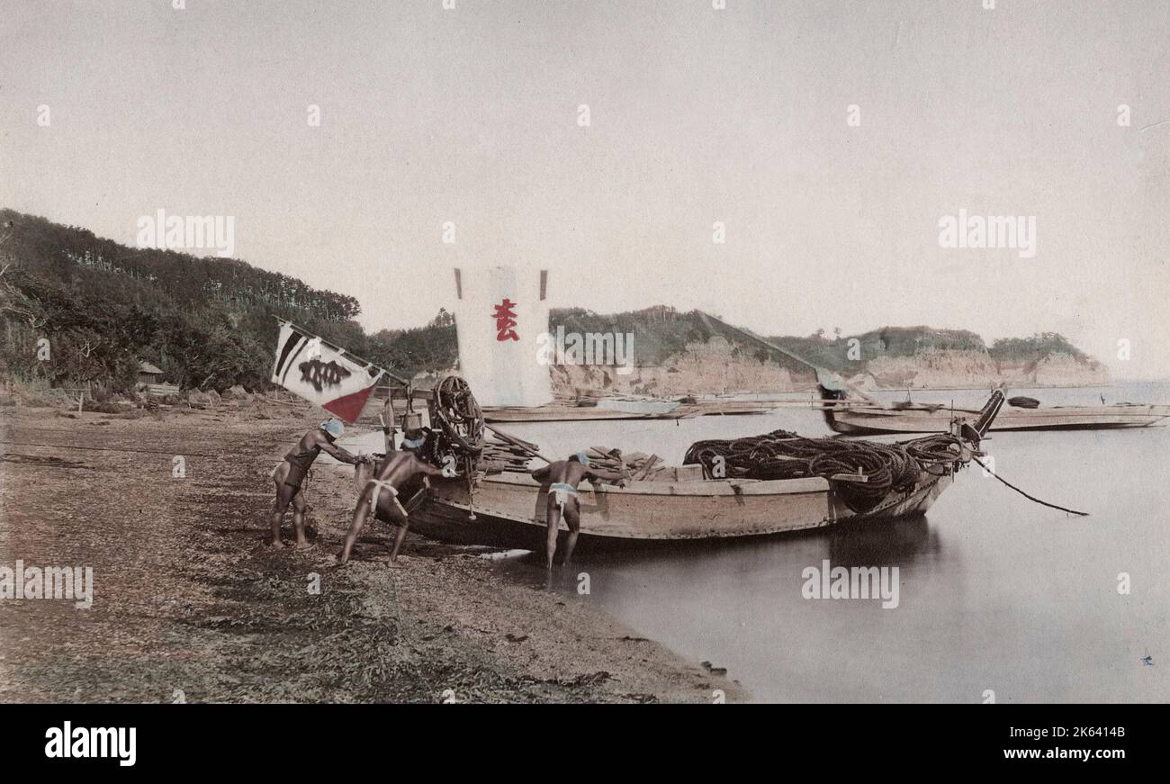 Fisherman launching their boat, Japan. Vintage 19th century photograph ...