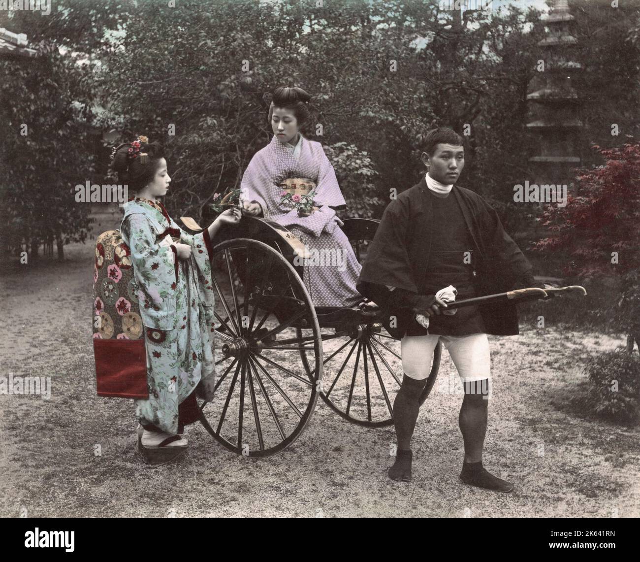 Young woman being pulled in a rickshaw, jinrikisha, Japan. Vintage 19th ...